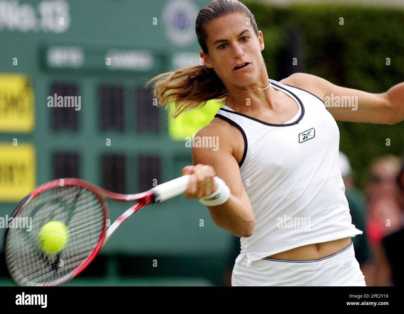 Amelie Mauresmo, of France, returns to Shenay Perry, of the USA, at ...