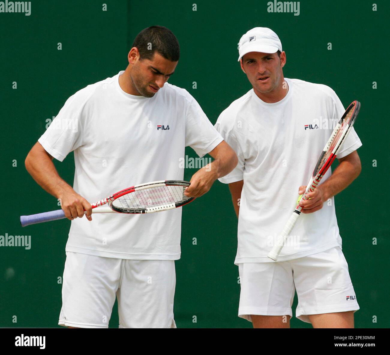 Jonathan Erlich, of Israel and teammate Andy Ram, left, during their ...