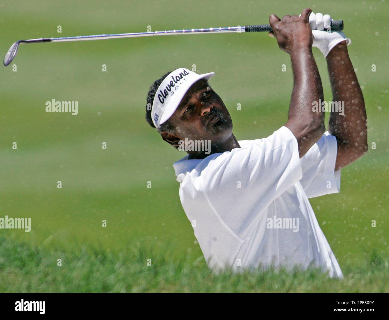 Vijay Singh,of Fiji, hits out of a sand trap on the ninth hole during ...
