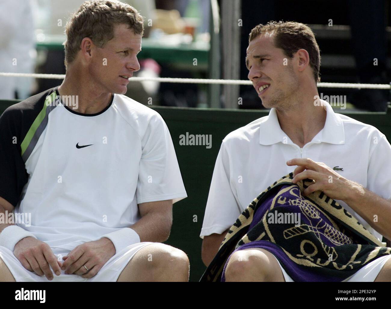 Mark Knowles, of the Bahamas, left, chats with teammate Michael Llodra ...