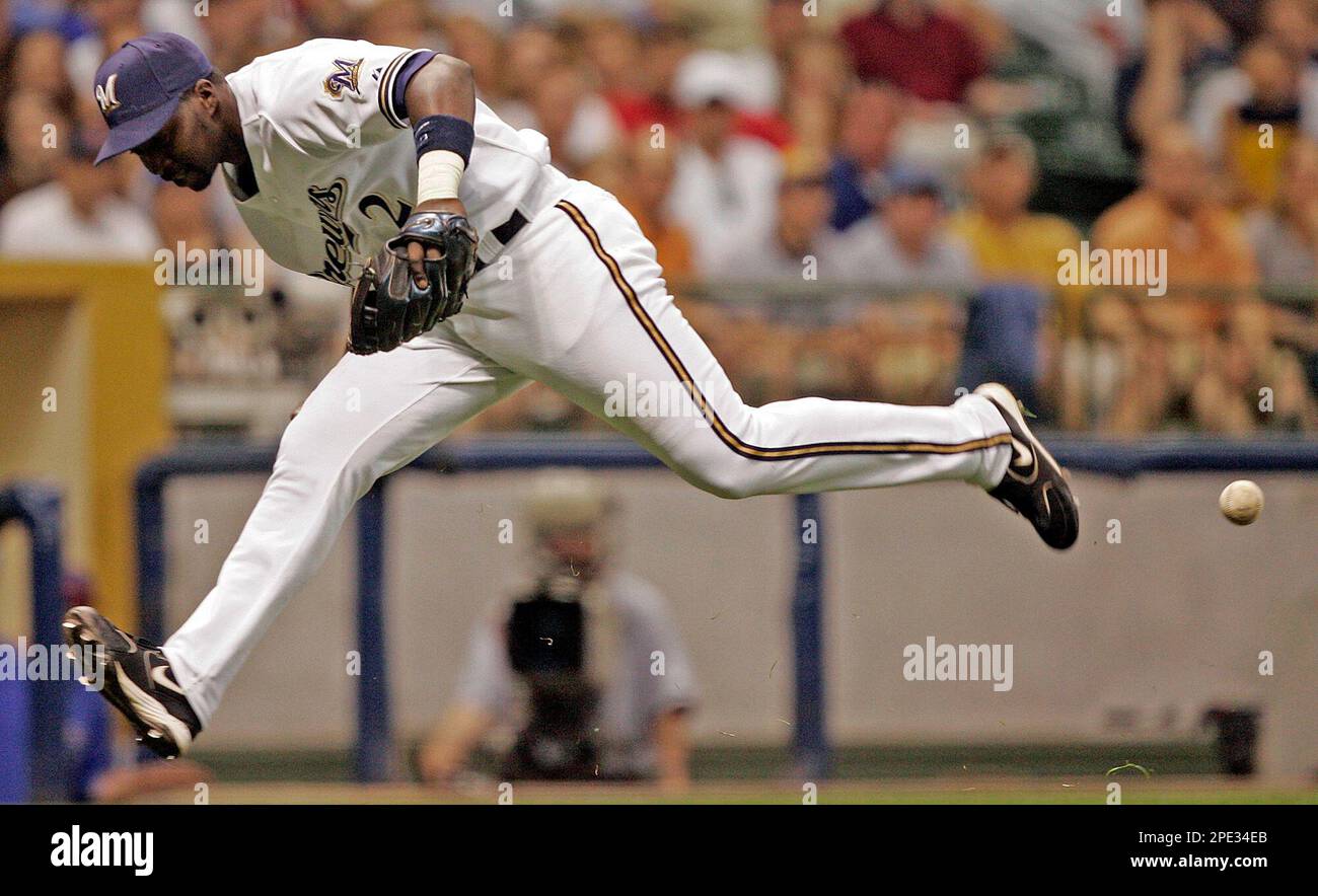 Milwaukee Brewers third baseman Bill Hall can't come up with a ball hit ...