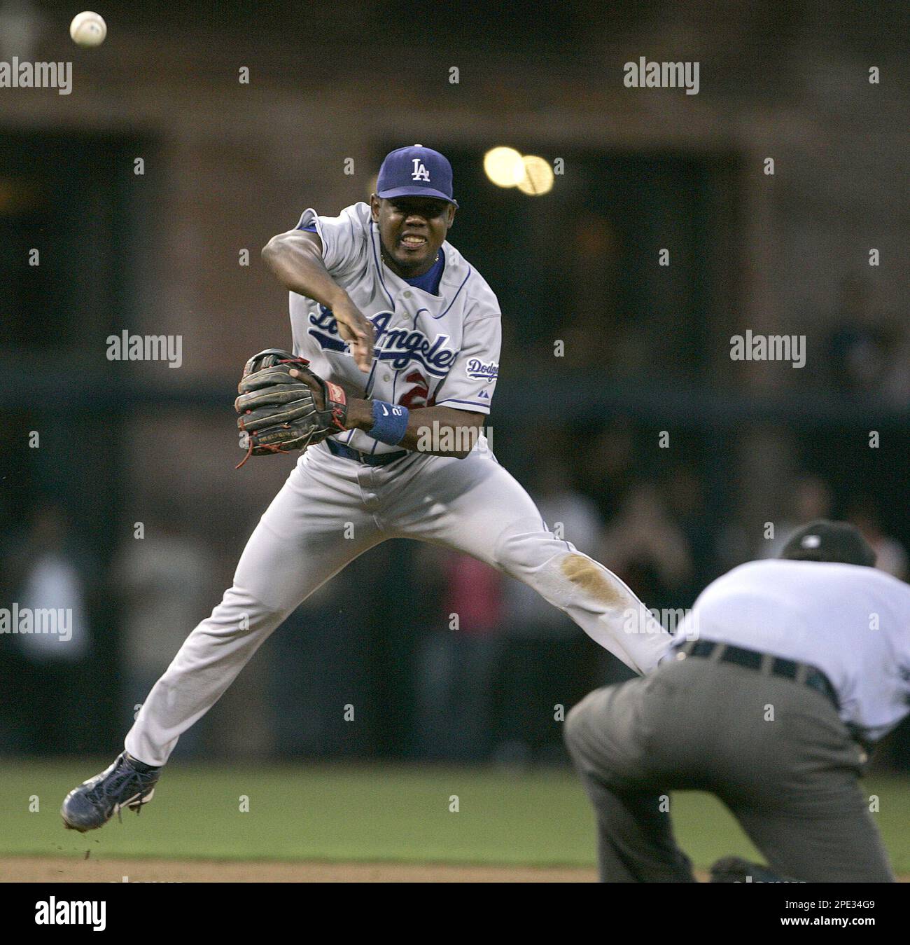 Los Angeles Dodgers third baseman Antonio Perez makes an off-balance ...