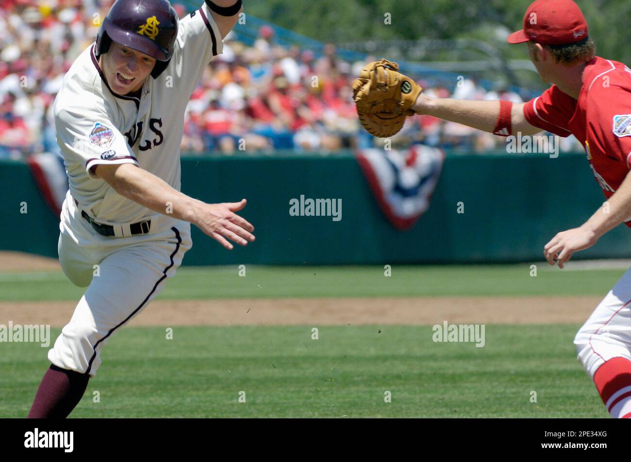 Nebraska's Brandon Buckman, right, tags out Arizona State's Willy Fox ...