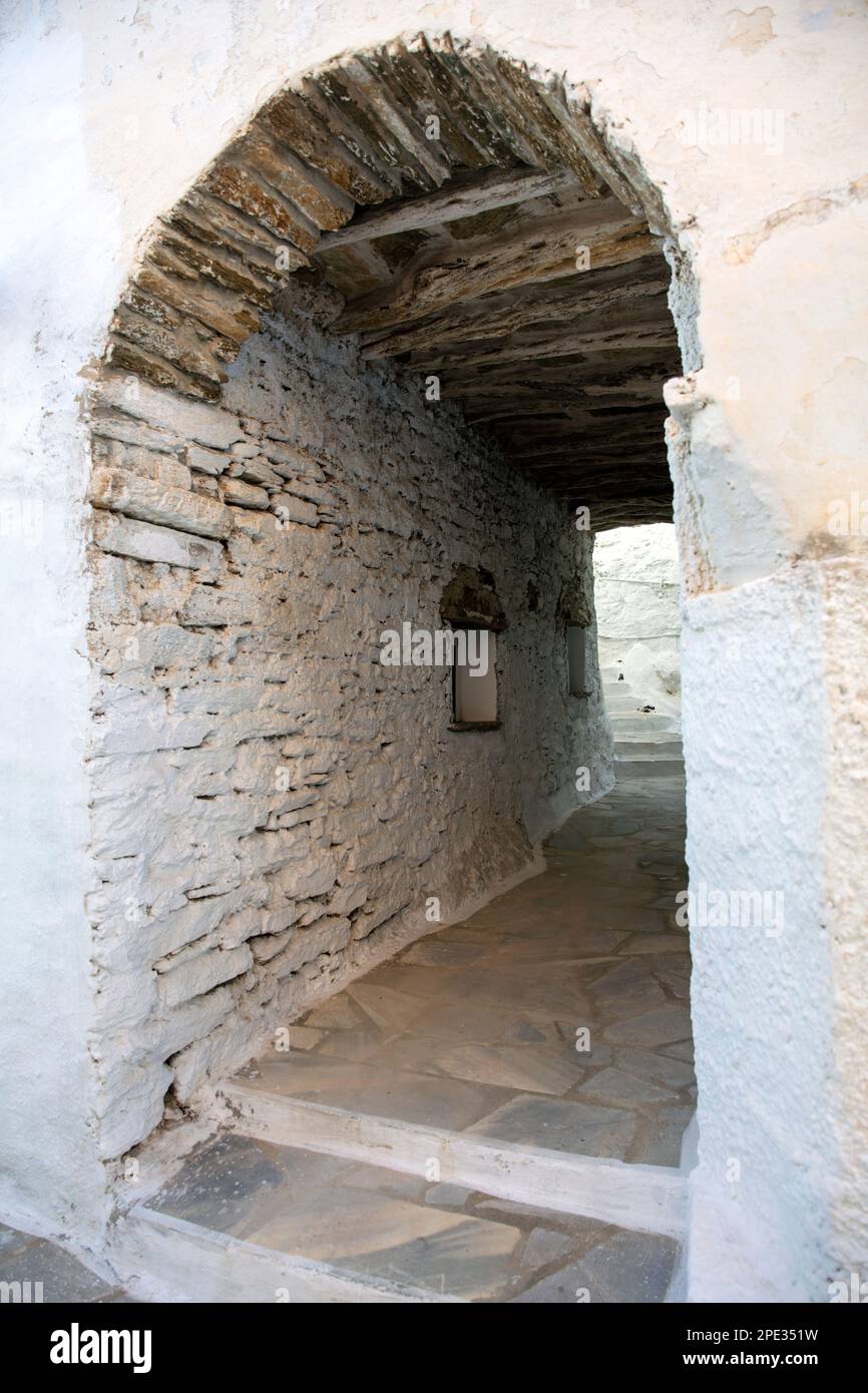Tinos island, Dio Horia village, Greece. Old wooden arched wall covers ...