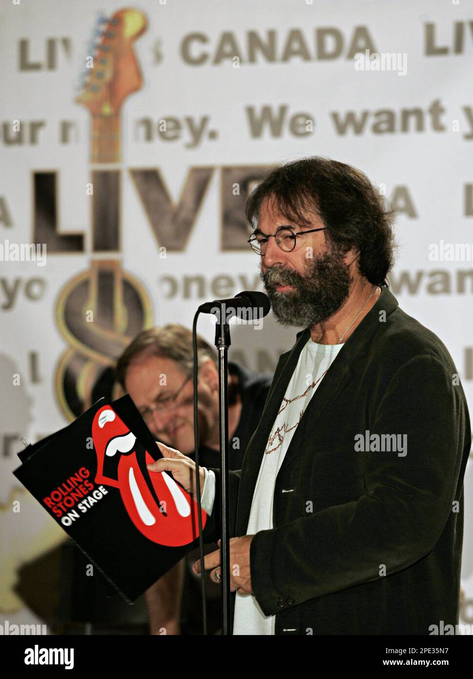 Concert organizer Michael Cohl holds a Rolling Stones album cover ...