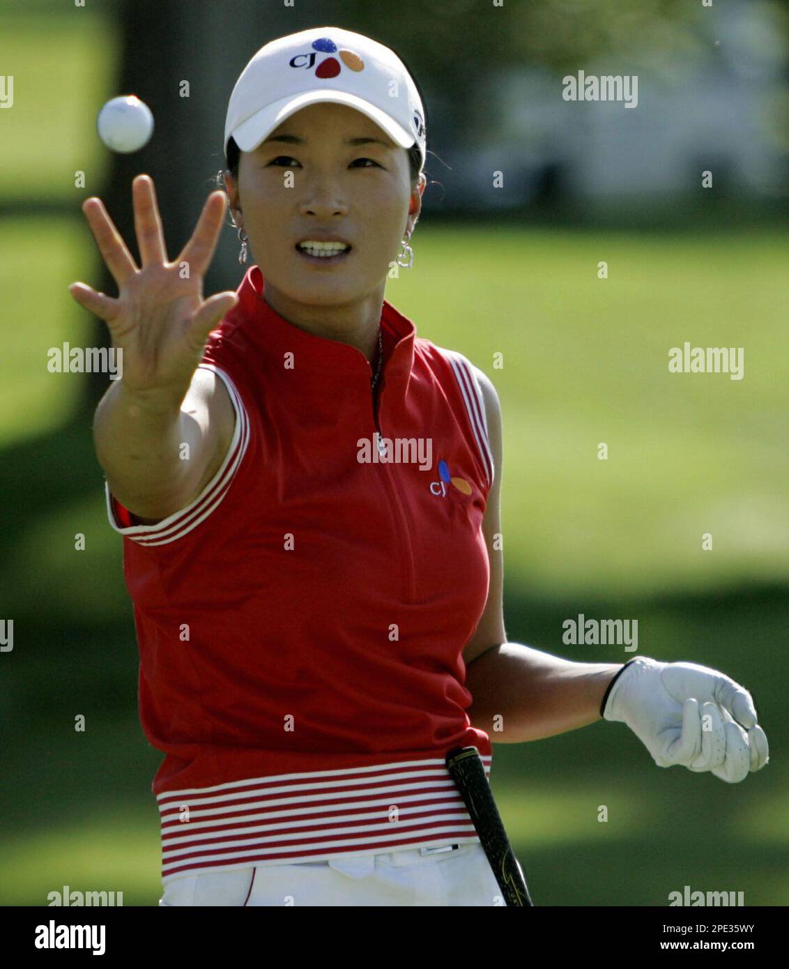 Se Ri Pak of South Korea reaches out to catch a golf ball from her ...