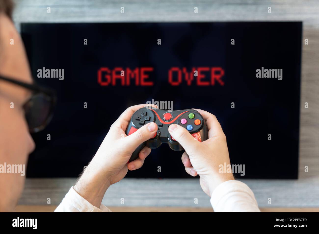 Hand holding playstation controller hi-res stock photography and images ...