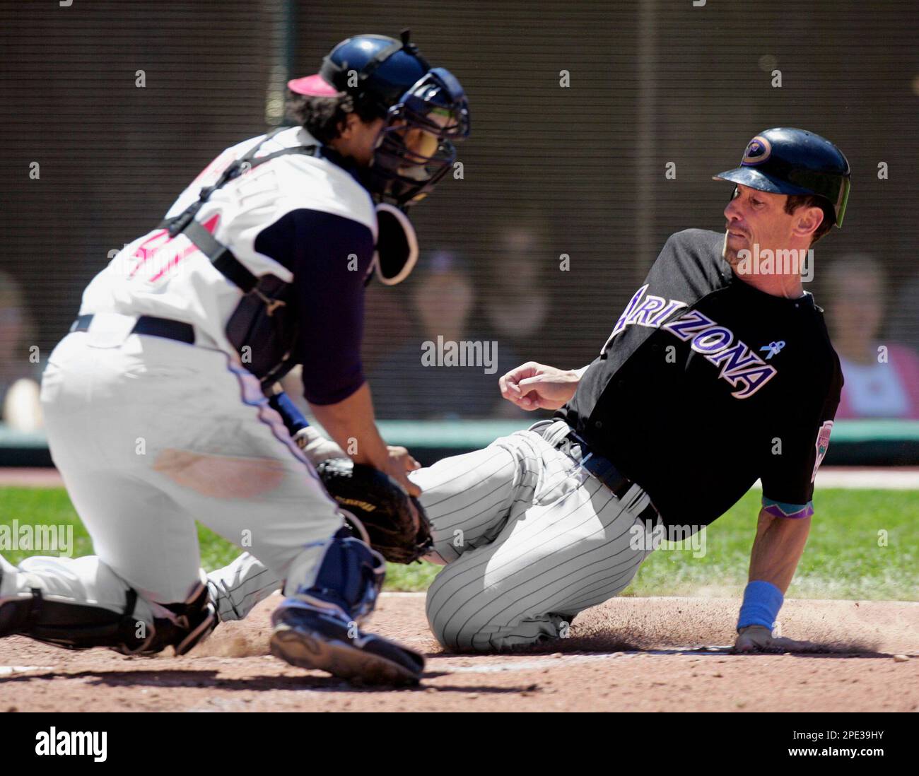 Arizona Diamondbacks' Luis Gonzalez, right, slides past the tag of ...