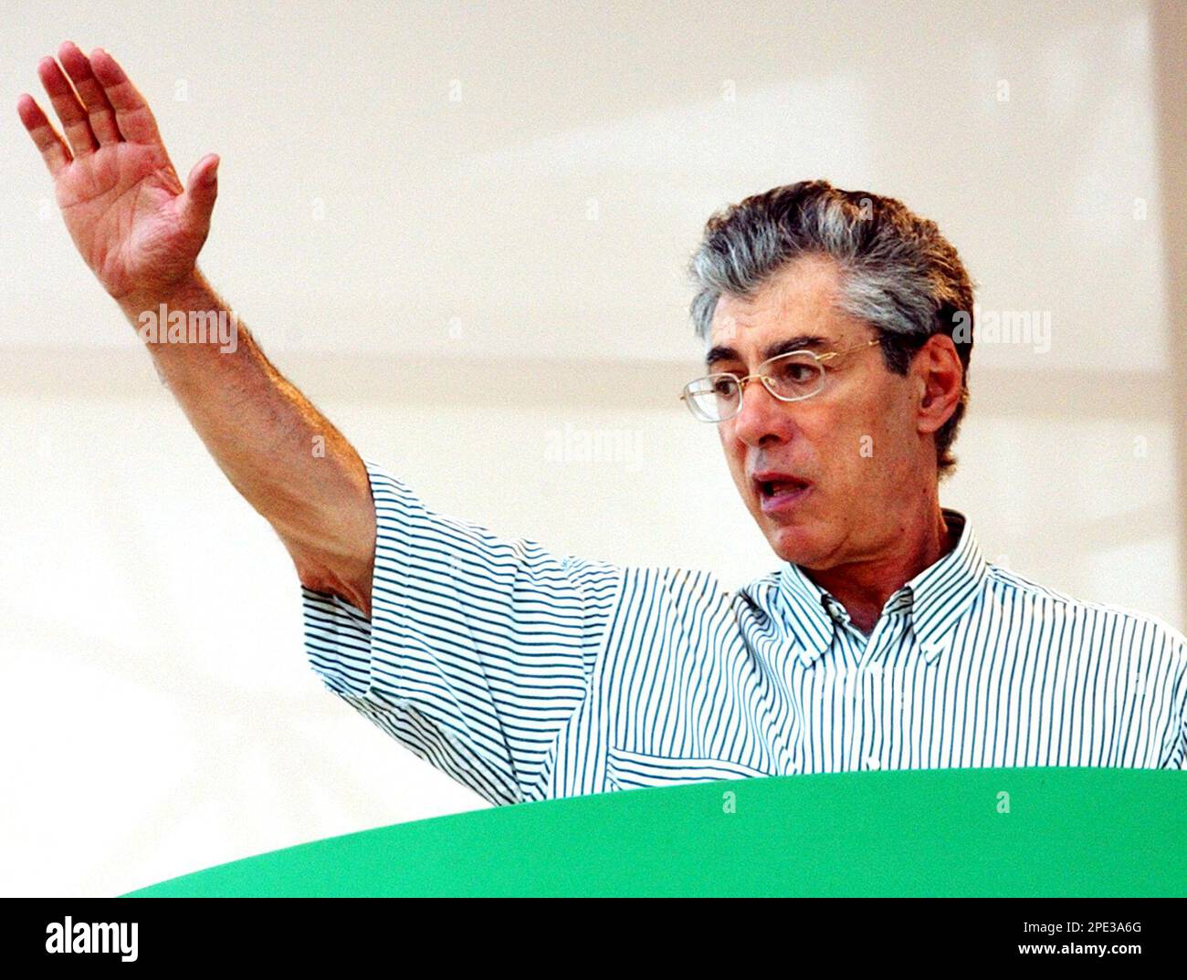 Italian Northern League party leader Umberto Bossi salutes the audience ...
