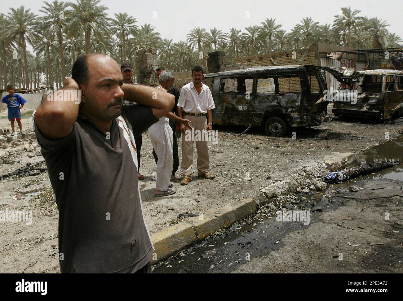 An unidentified Iraqi man, who lost his car in a carbomb attack in ...