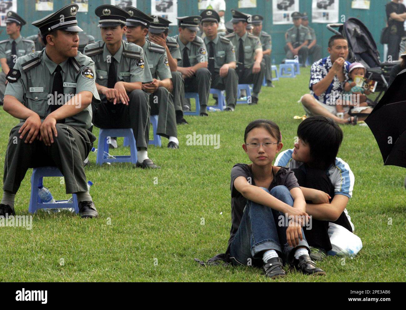 Chinese security guard line the perimeter at a music festival in ...