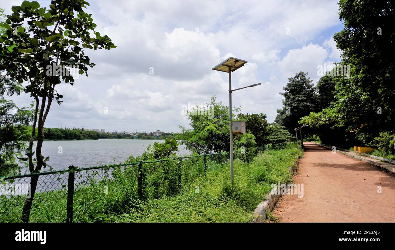 Landscape view of walking lane of Agara lake. Well maintained lake and ...