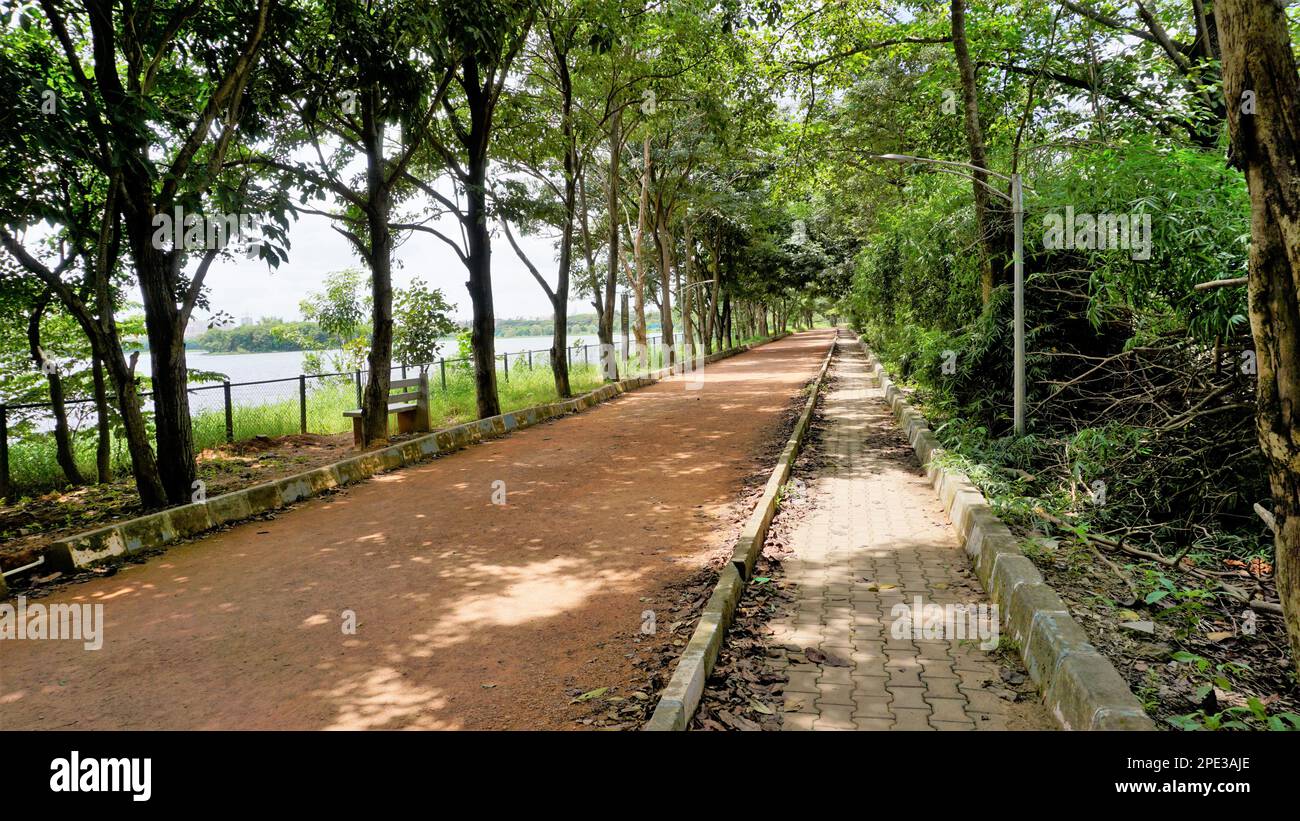 Landscape view of walking lane of Agara lake. Well maintained lake and ...