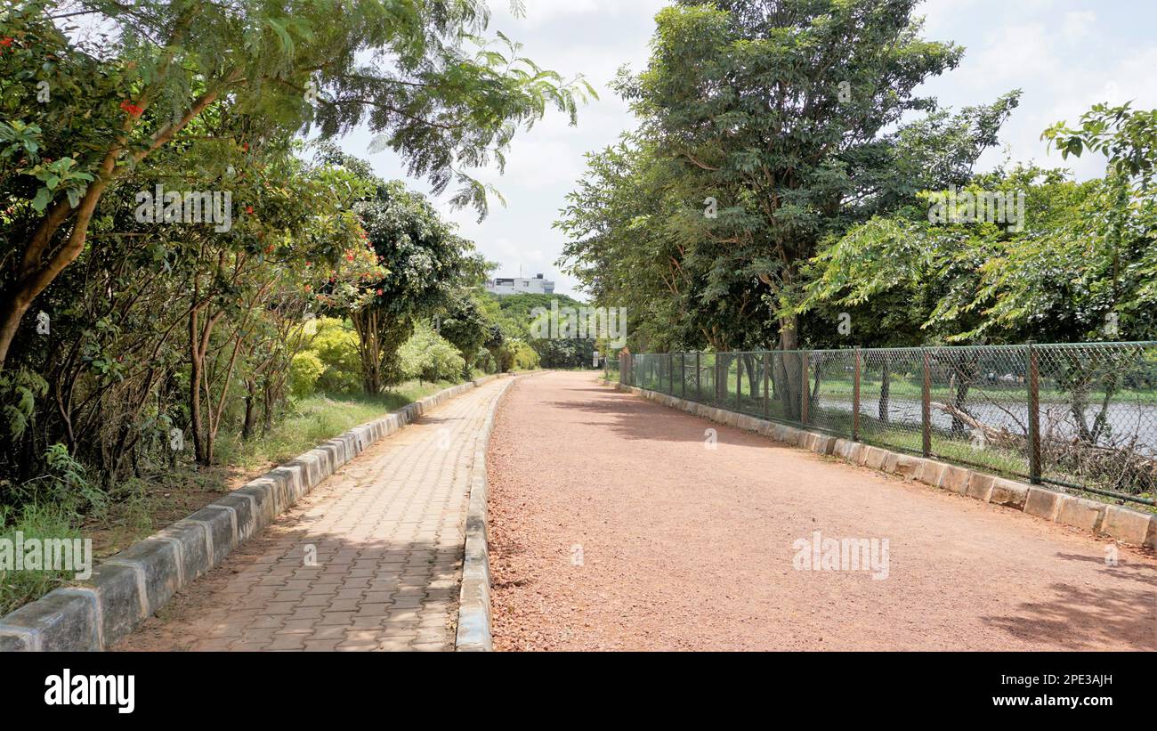 Landscape view of walking lane of Agara lake. Well maintained lake and ...