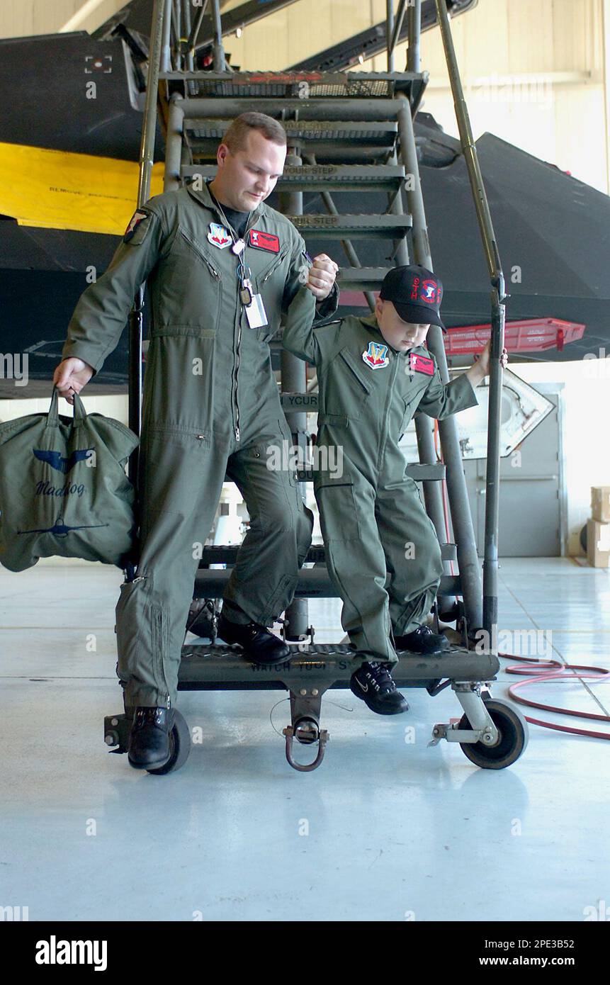 Capt. Tim Maddog Smith, with the 9th Fighter Squadron, helps Nathan Dog ...