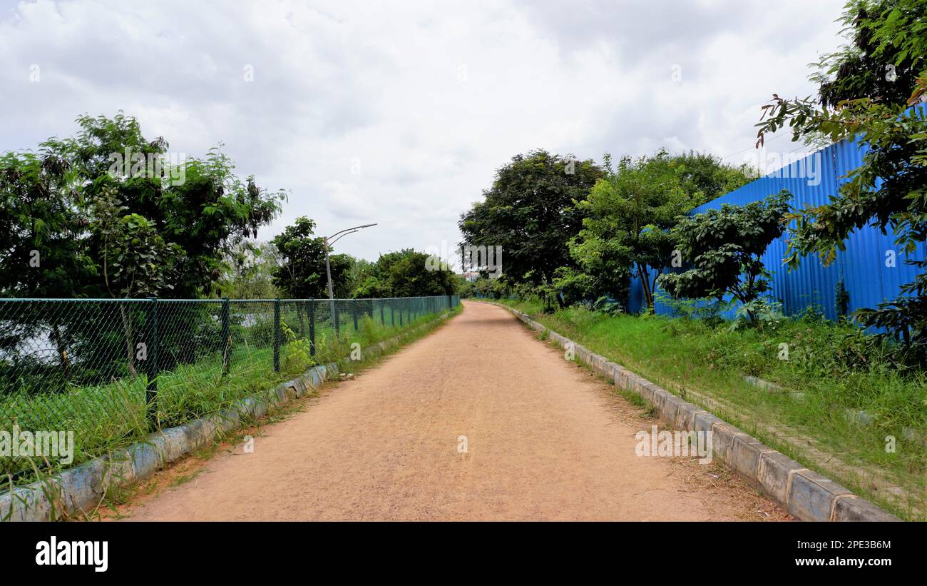 Landscape view of walking lane of Agara lake. Well maintained lake and ...