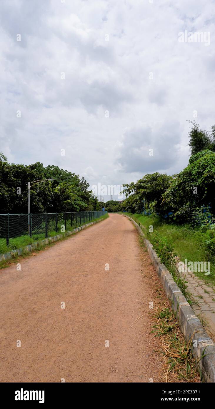 Landscape view of walking lane of Agara lake. Well maintained lake and ...
