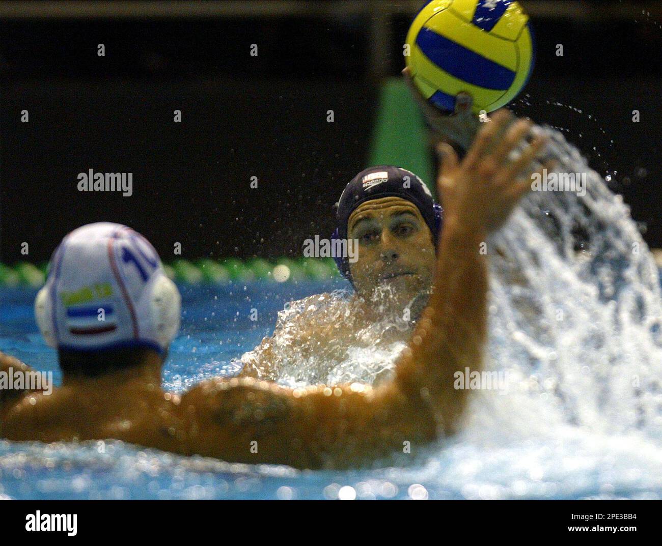 American player Michael March, right, in a tussle for the ball with ...