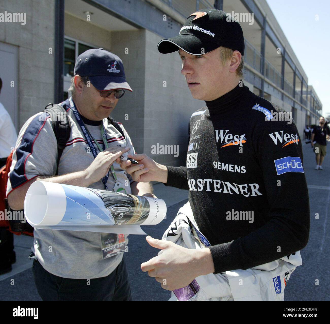McLaren Formula One driver Kimi Raikkonen of Finland finishes an ...