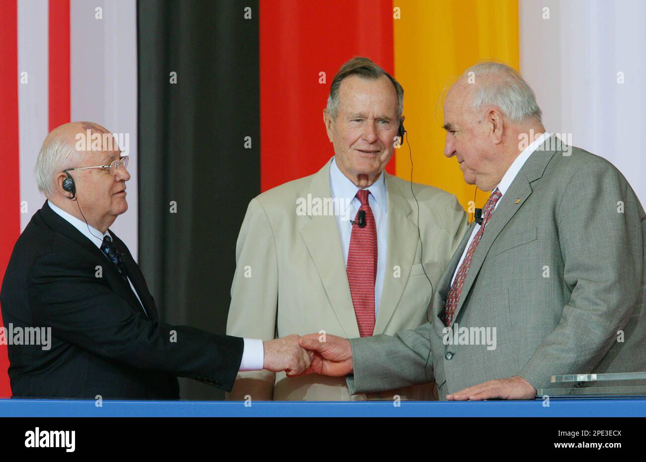 Former Soviet leader Mikhail S. Gorbachev shake hands with former ...