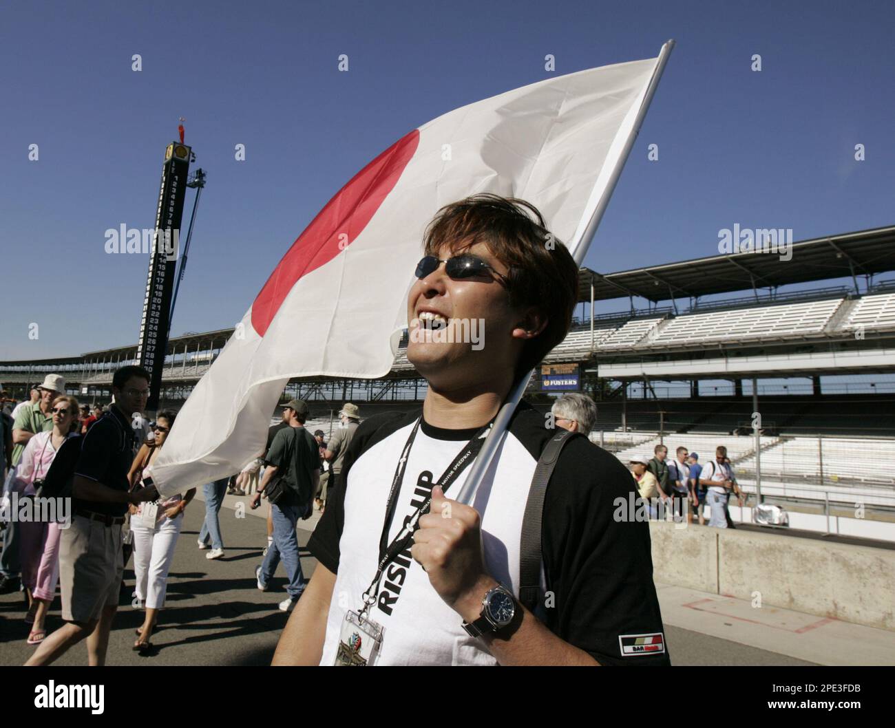 Formula One fan Yusuke Inoue of Chicago carries a Japanese flag at ...