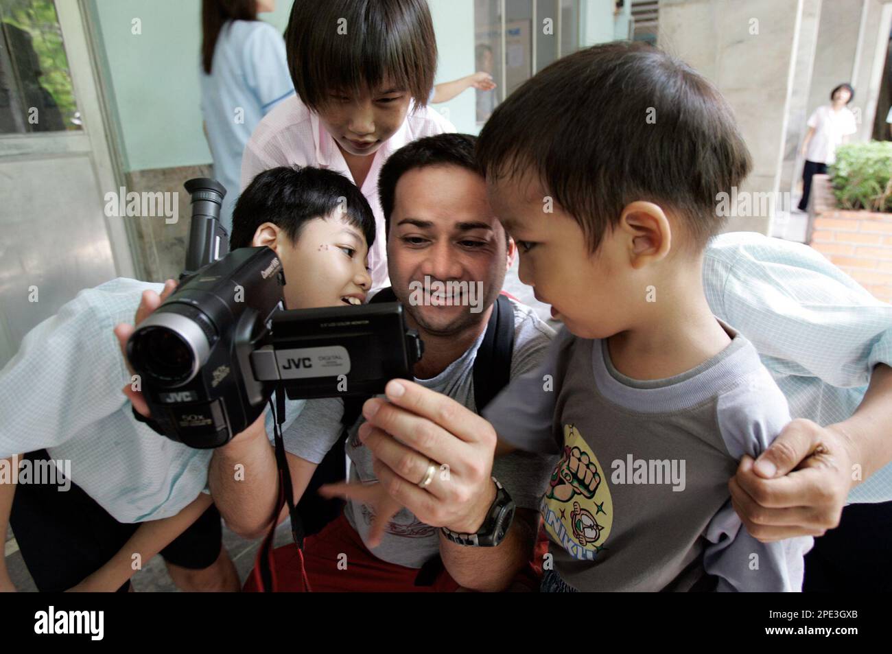 Vietnamese-American orphan Thao Chau Le Tran from Orando, Fla., shows ...