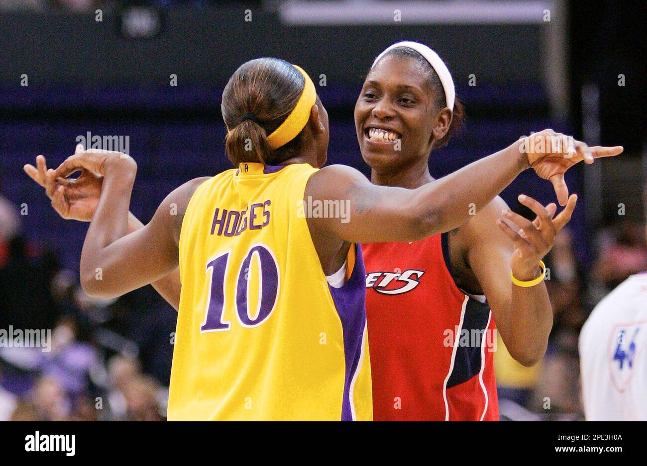 Los Angeles Sparks' Doneeka Hodges, left, hugs her sister, Roneeka ...