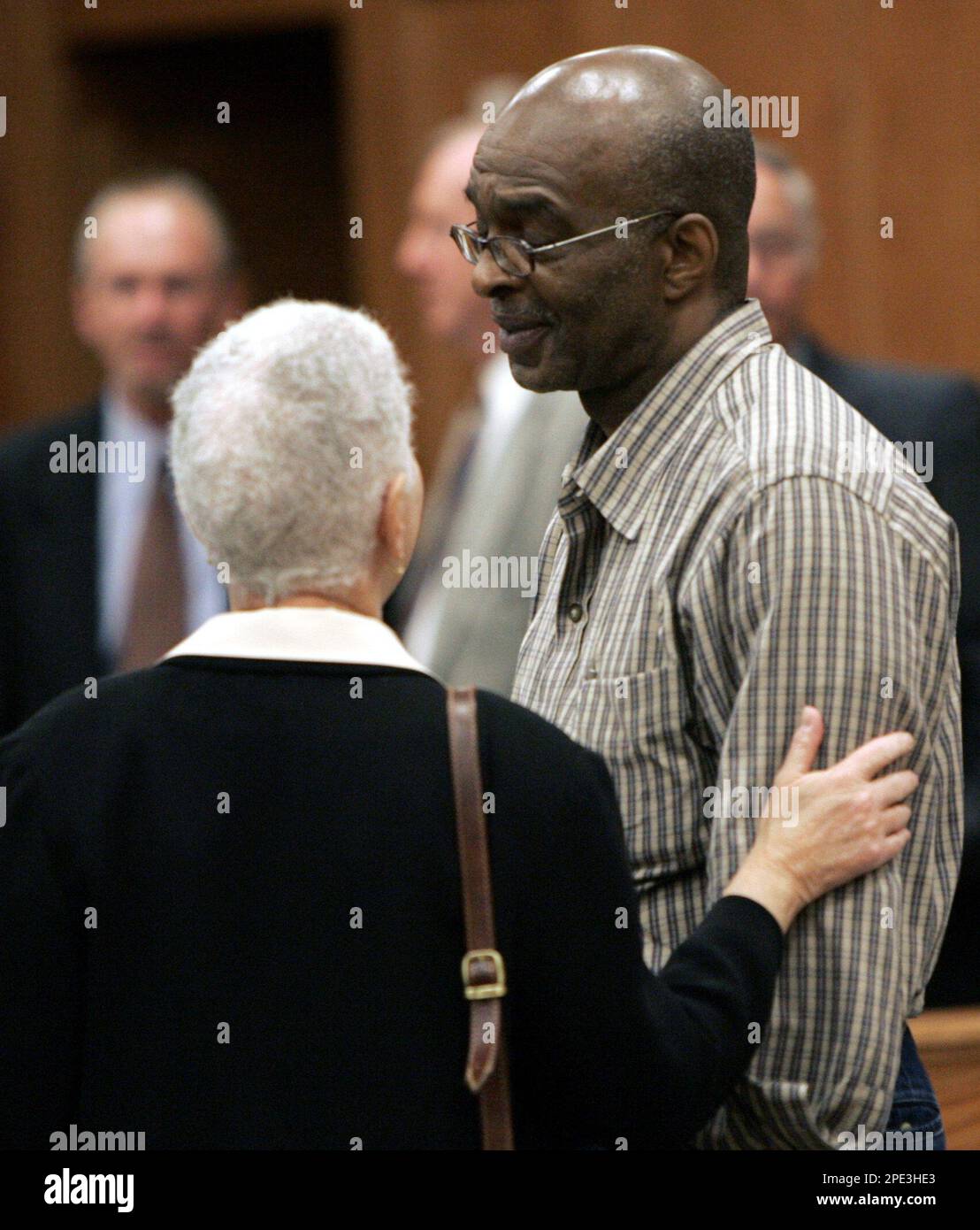 Ben Chaney, right, and Rita Schwerner Bender confer following opening ...