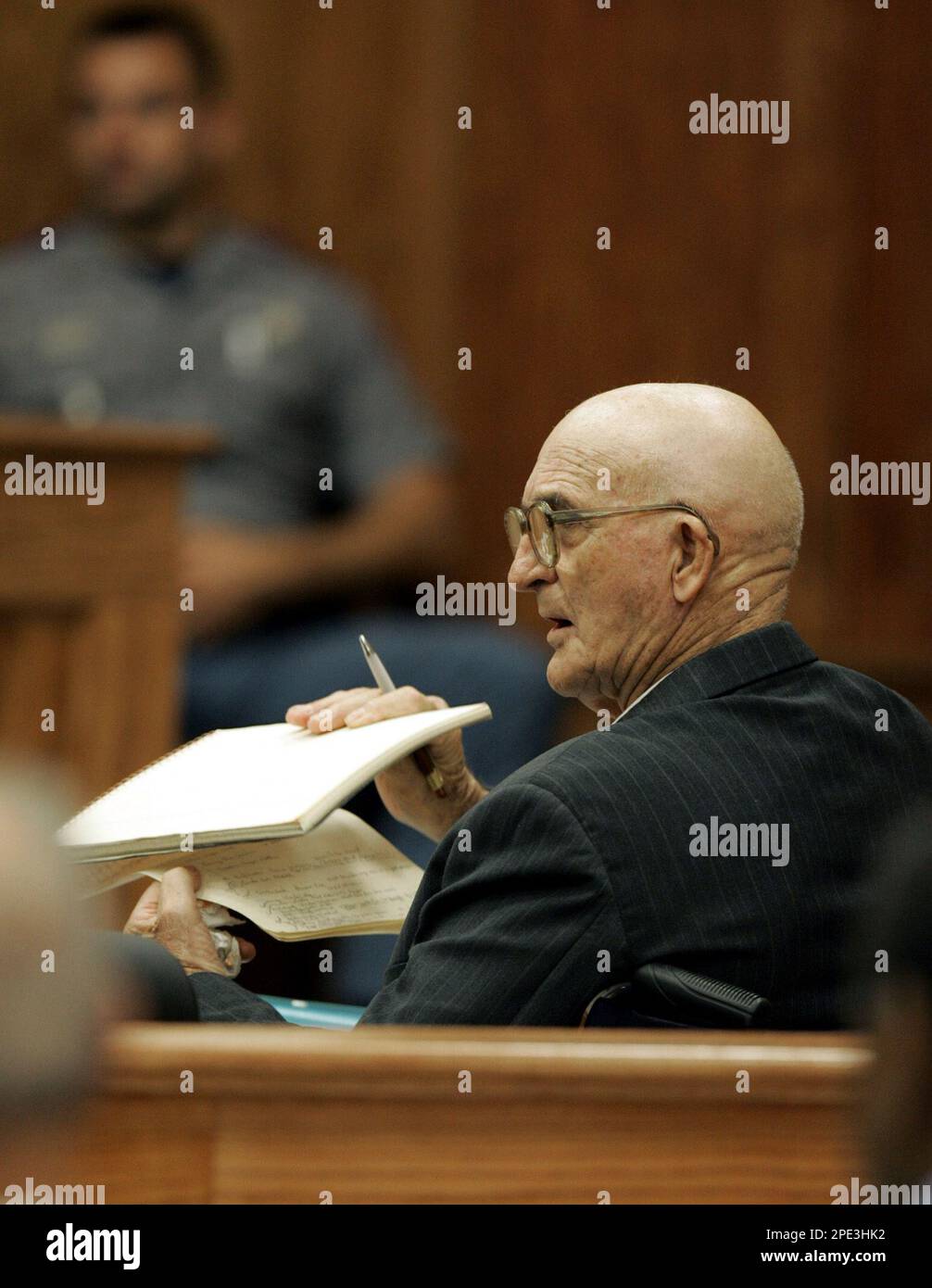 Edgar Ray Killen of Union, Miss., takes notes at his trial for the 1964 ...