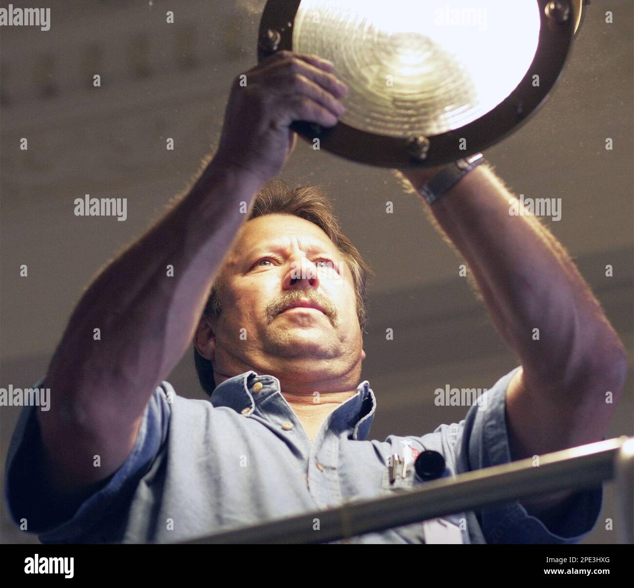 Ralph Cain, an electrician for the State Preservation Board, cleans ...