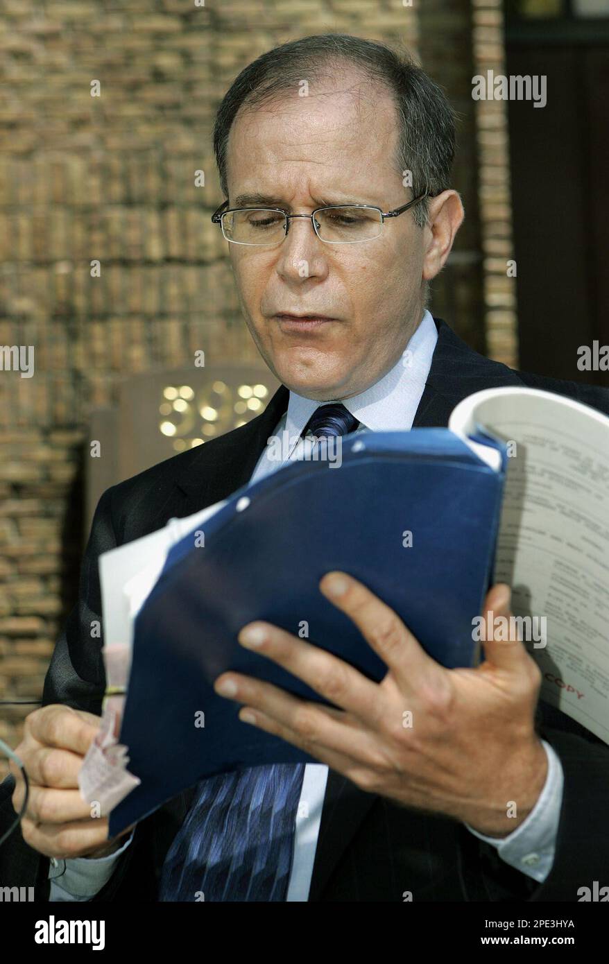 George Felos, attorney for Michael Schiavo, reads from Terri Schiavo's ...