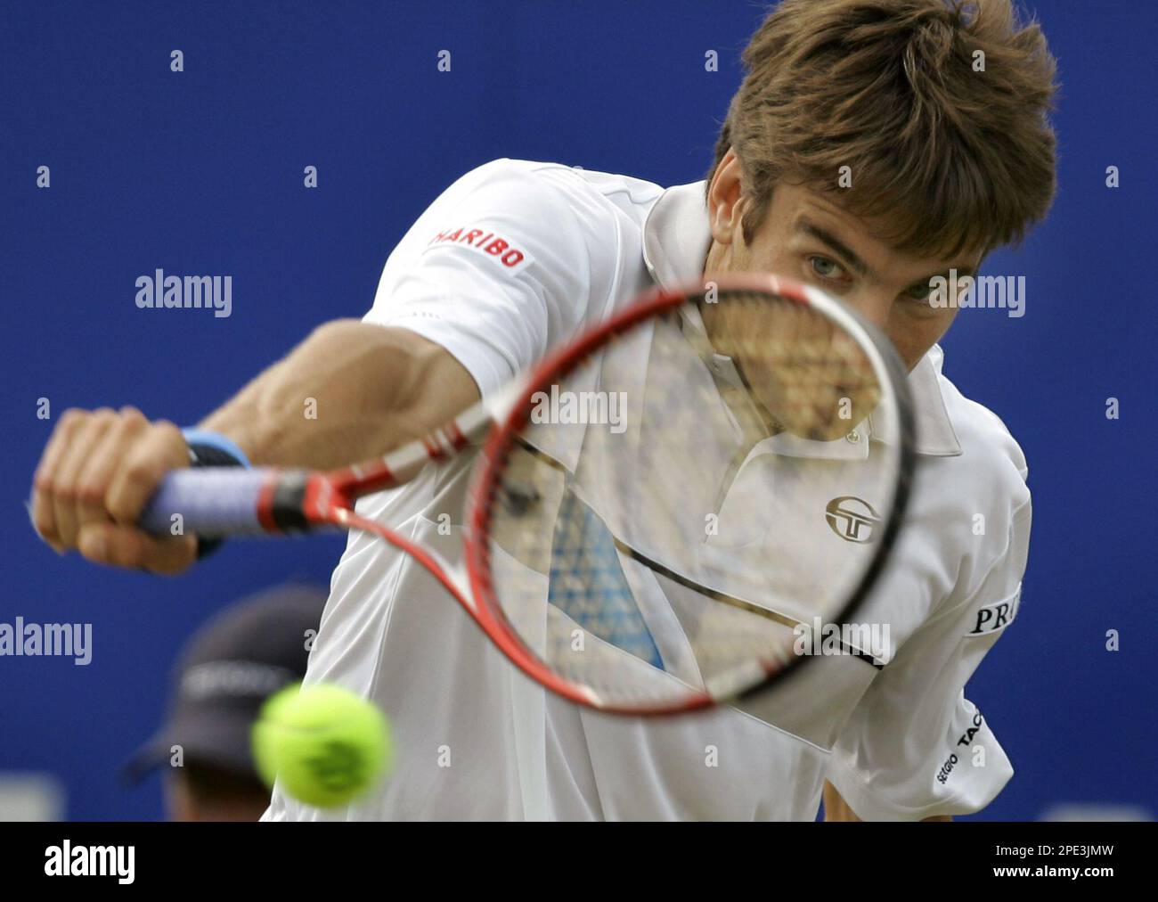 Spain's Tommy Robredo return the ball to Germany's Lars Burgsmuller at ...