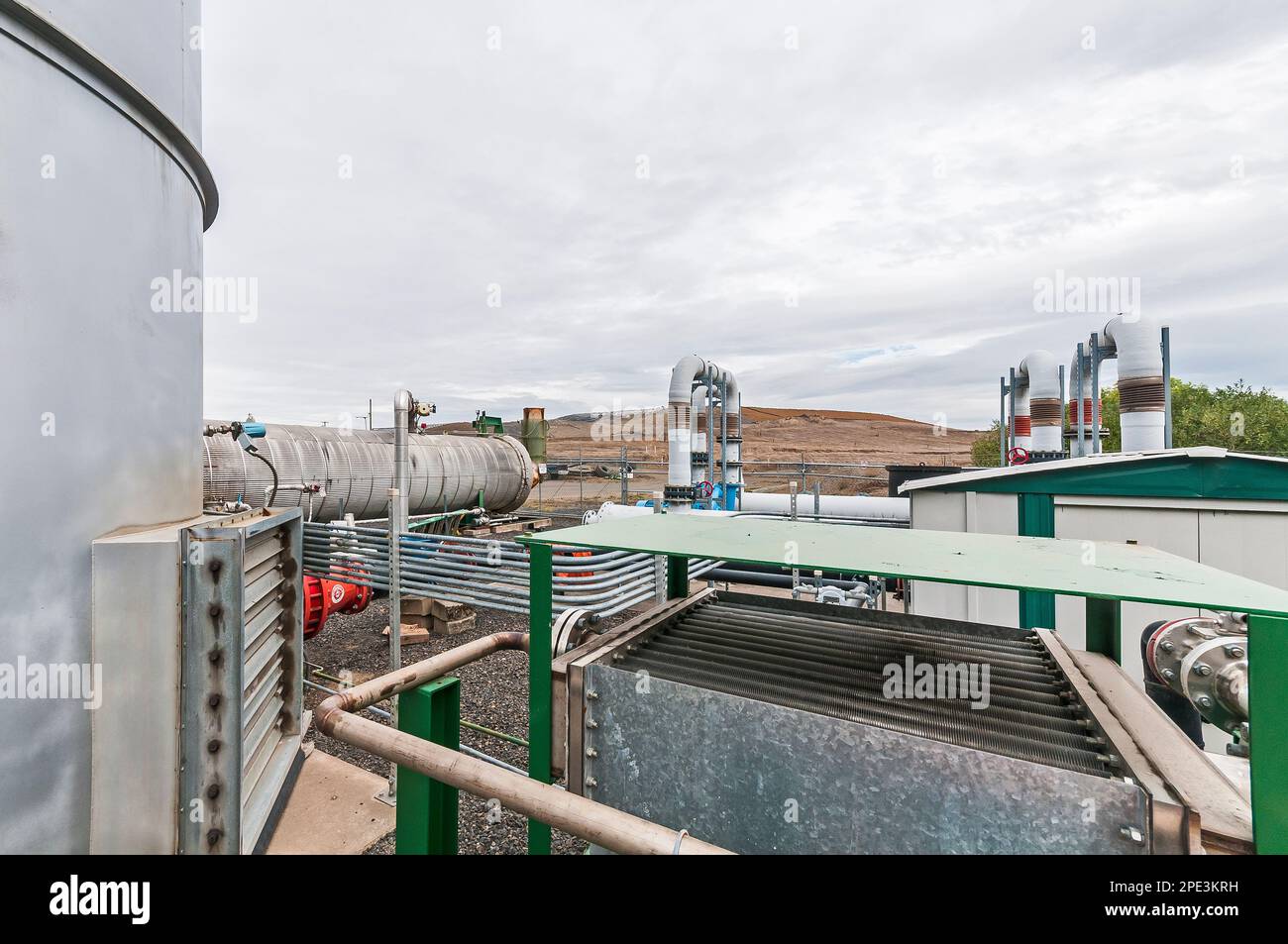 A fenced area containing tanks and piping for methane gas which is ...