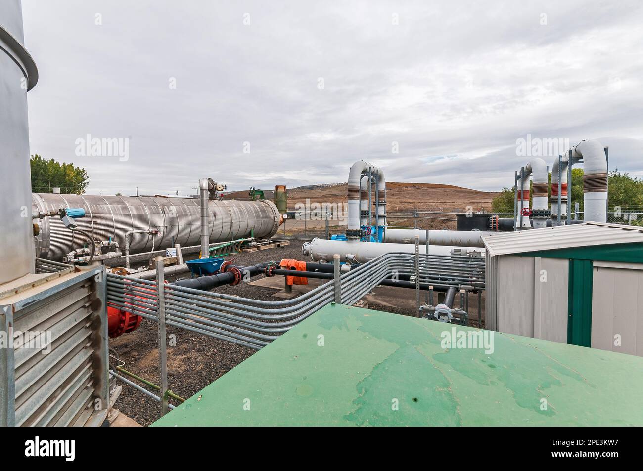 A fenced area containing tanks and piping for methane gas which is ...