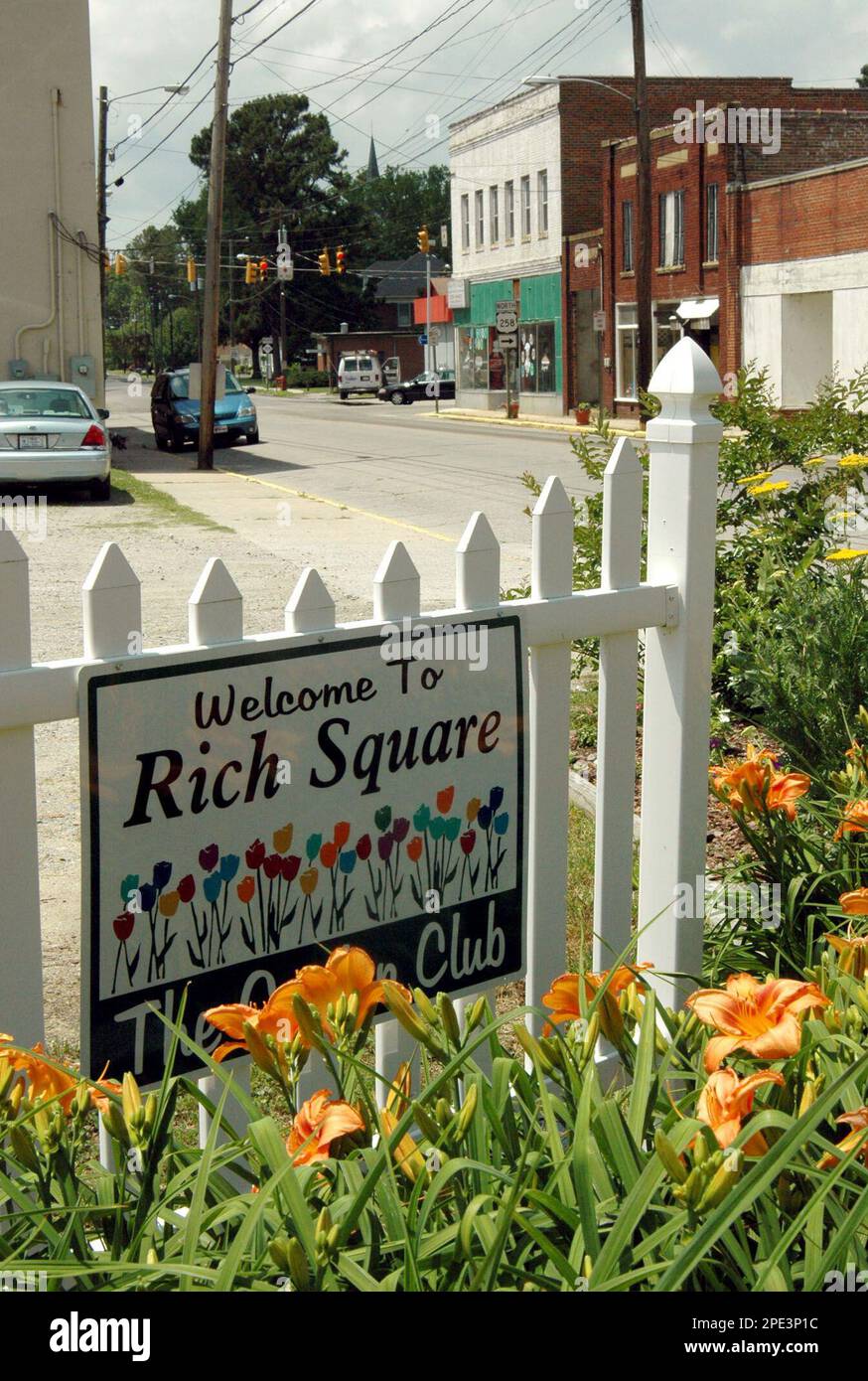 Flowers planted by the Rich Square Garden Club welcome visitors Friday ...