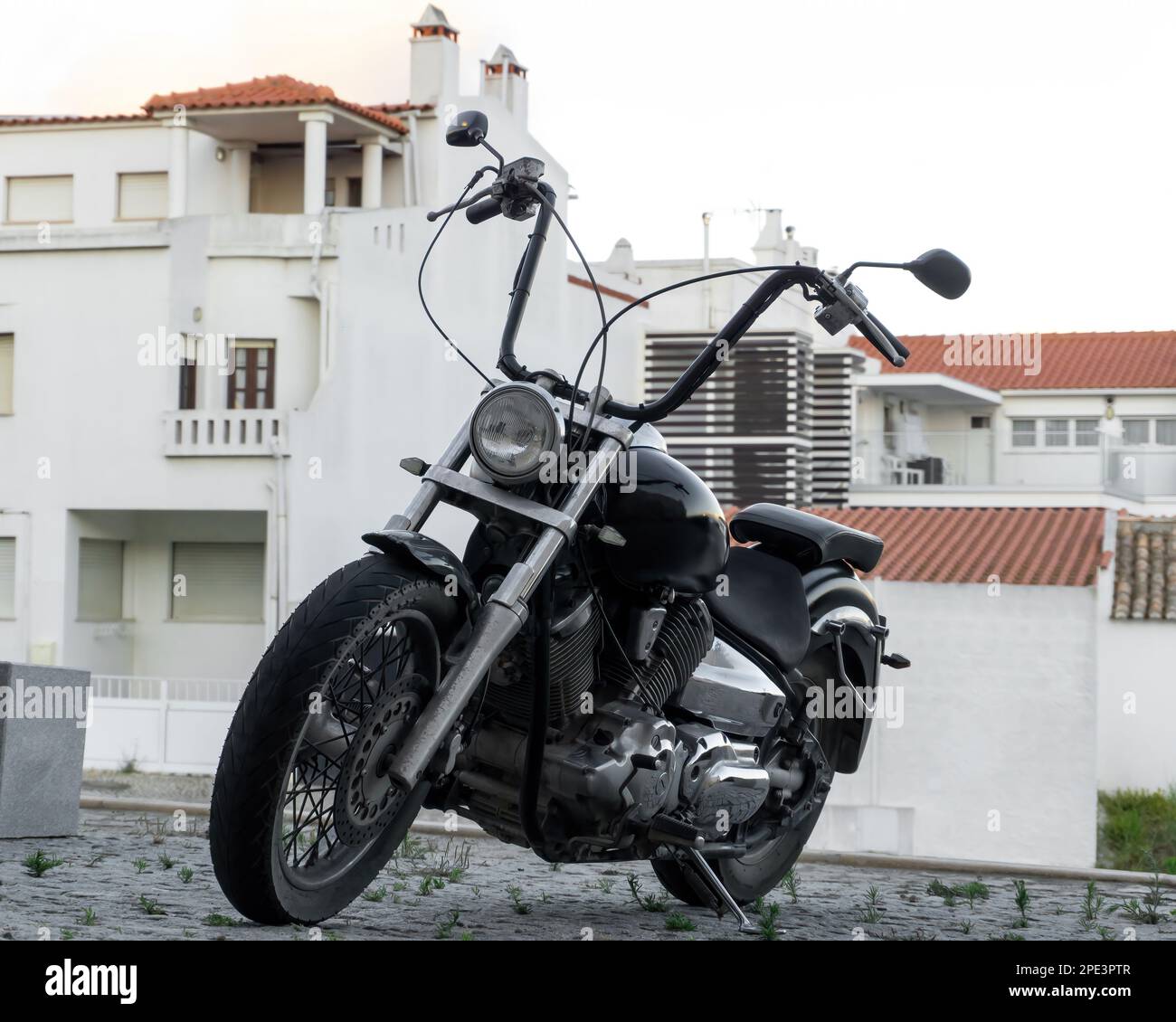 Black classic chopper motorcycle with chrome details. Front view Stock ...