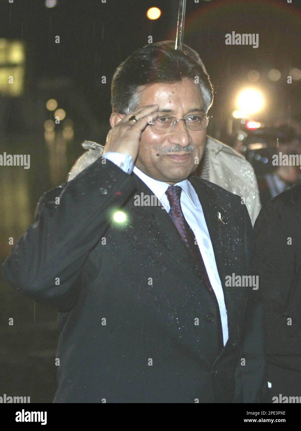 Pakistani President General Pervez Musharraf salutes military personnel ...