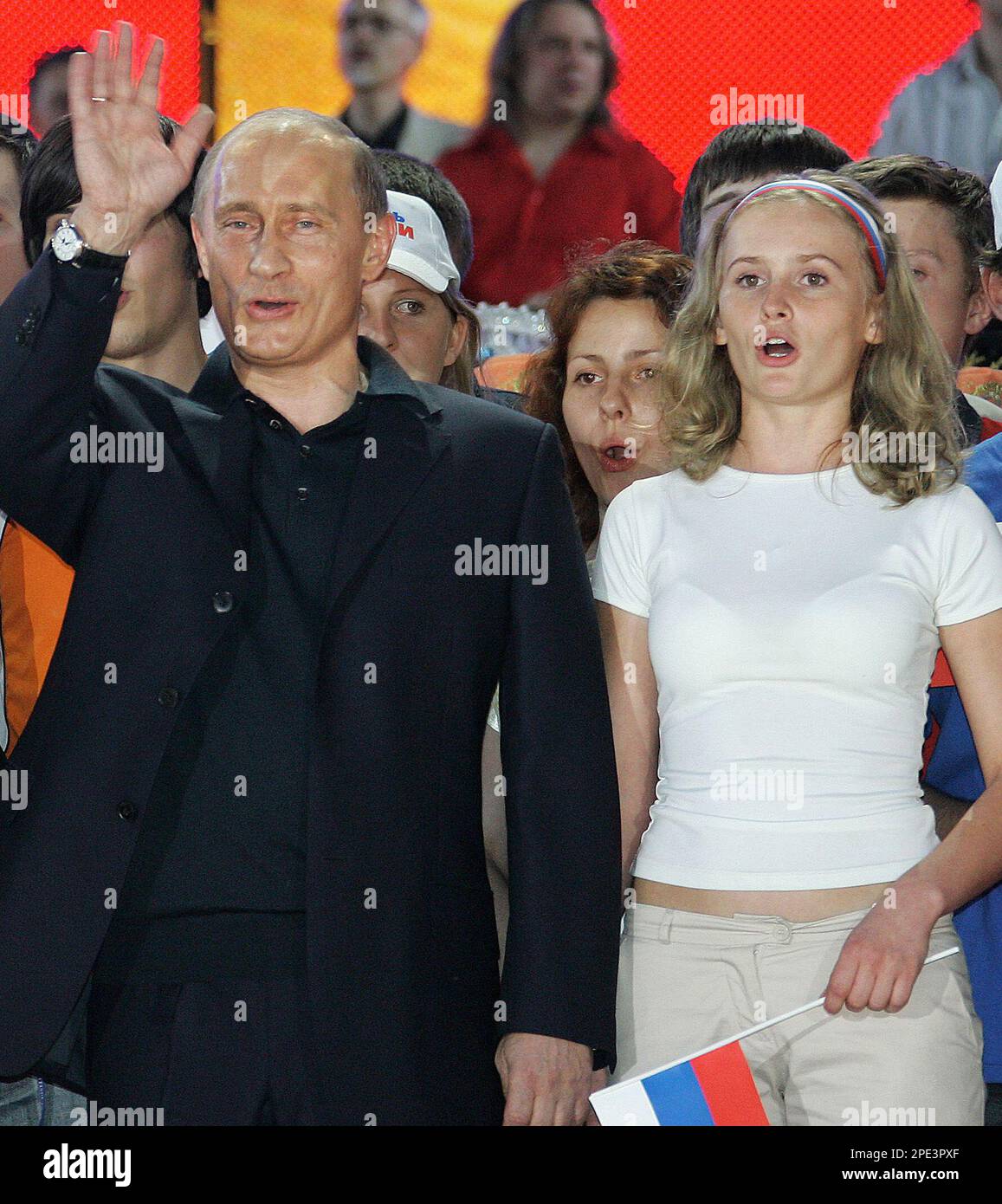 President Vladimir Putin and young people sing the Russian national ...