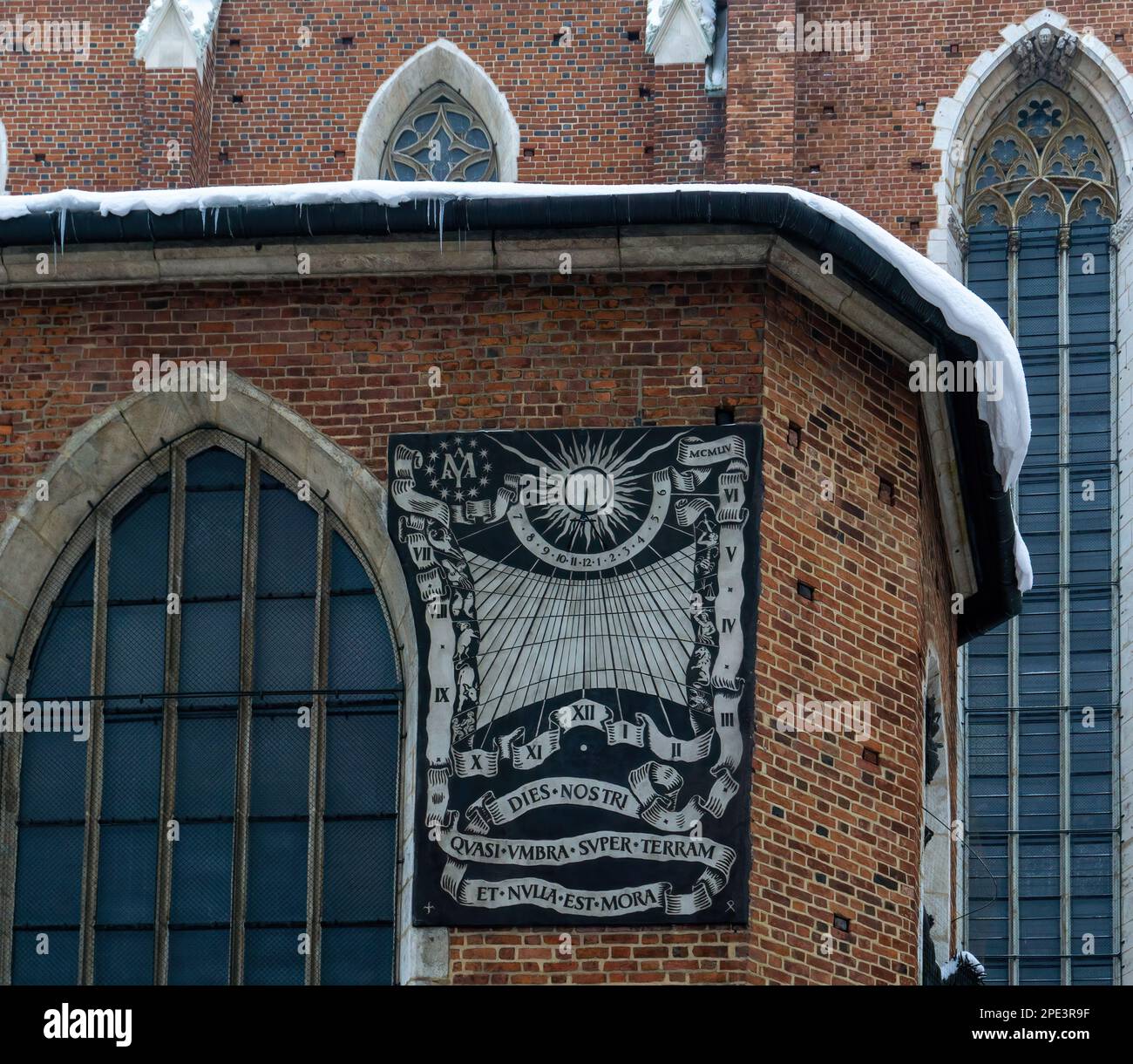 Wall sundial on the brick wall of the ancient St. Mary's Cathedral in ...