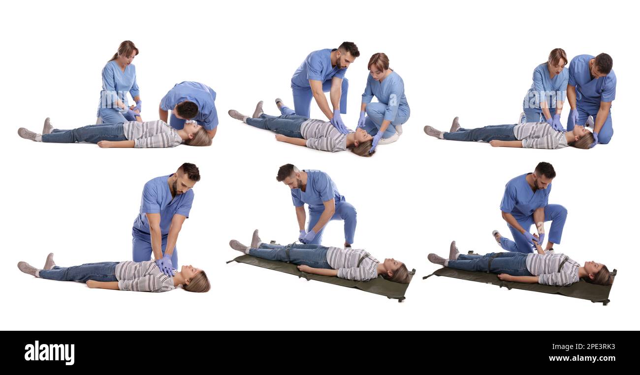 Doctors performing first aid on unconscious woman against white ...