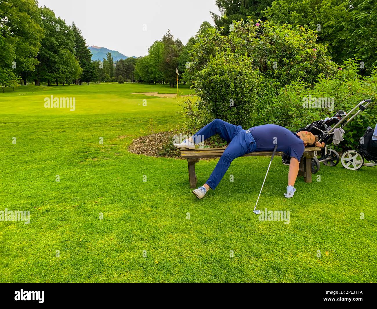 Tired Golfer Sleeping on a Bench on Golf Course in Switzerland Stock ...