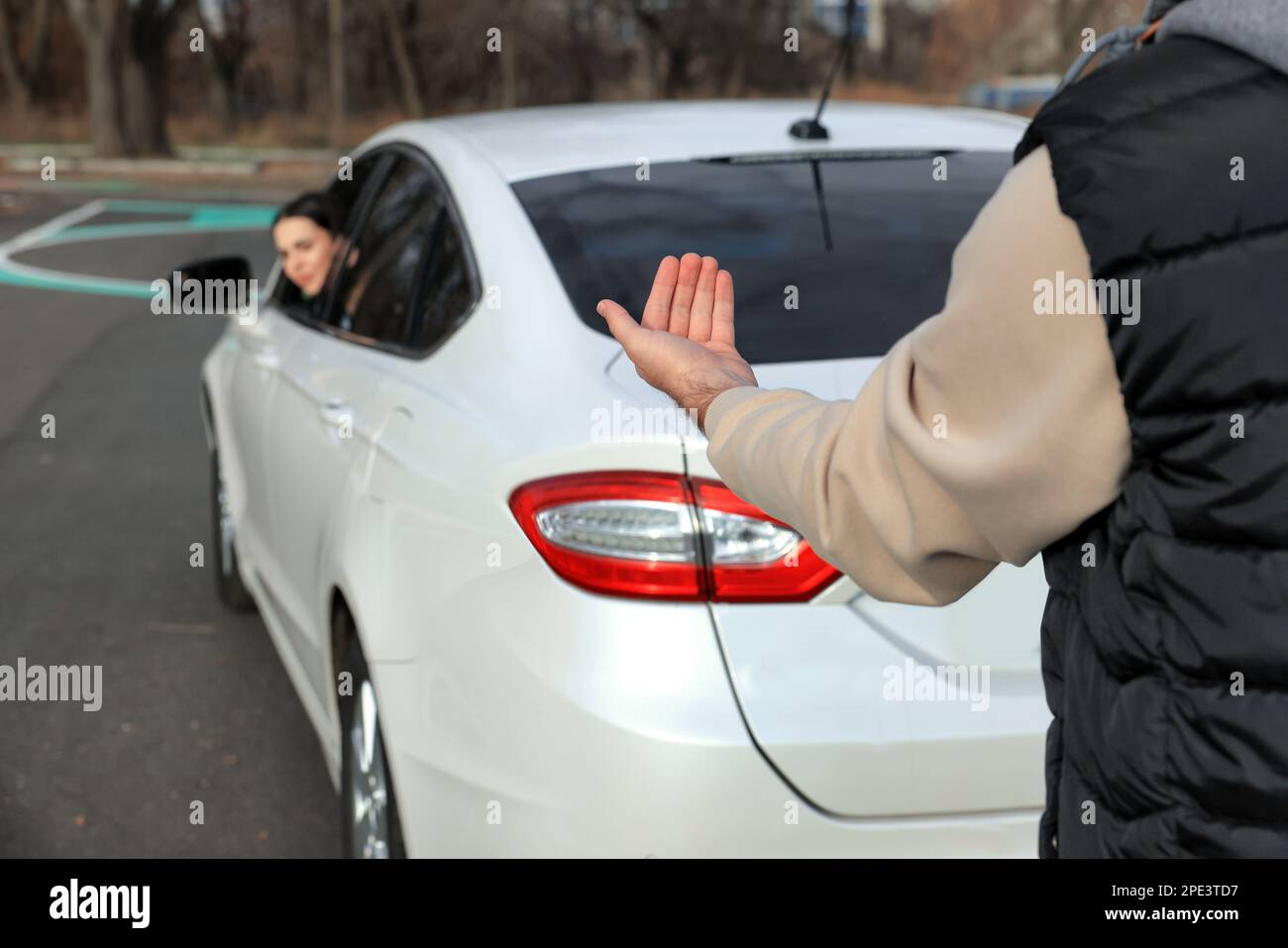 Instructor and student in car during exam on test track. Driving school ...
