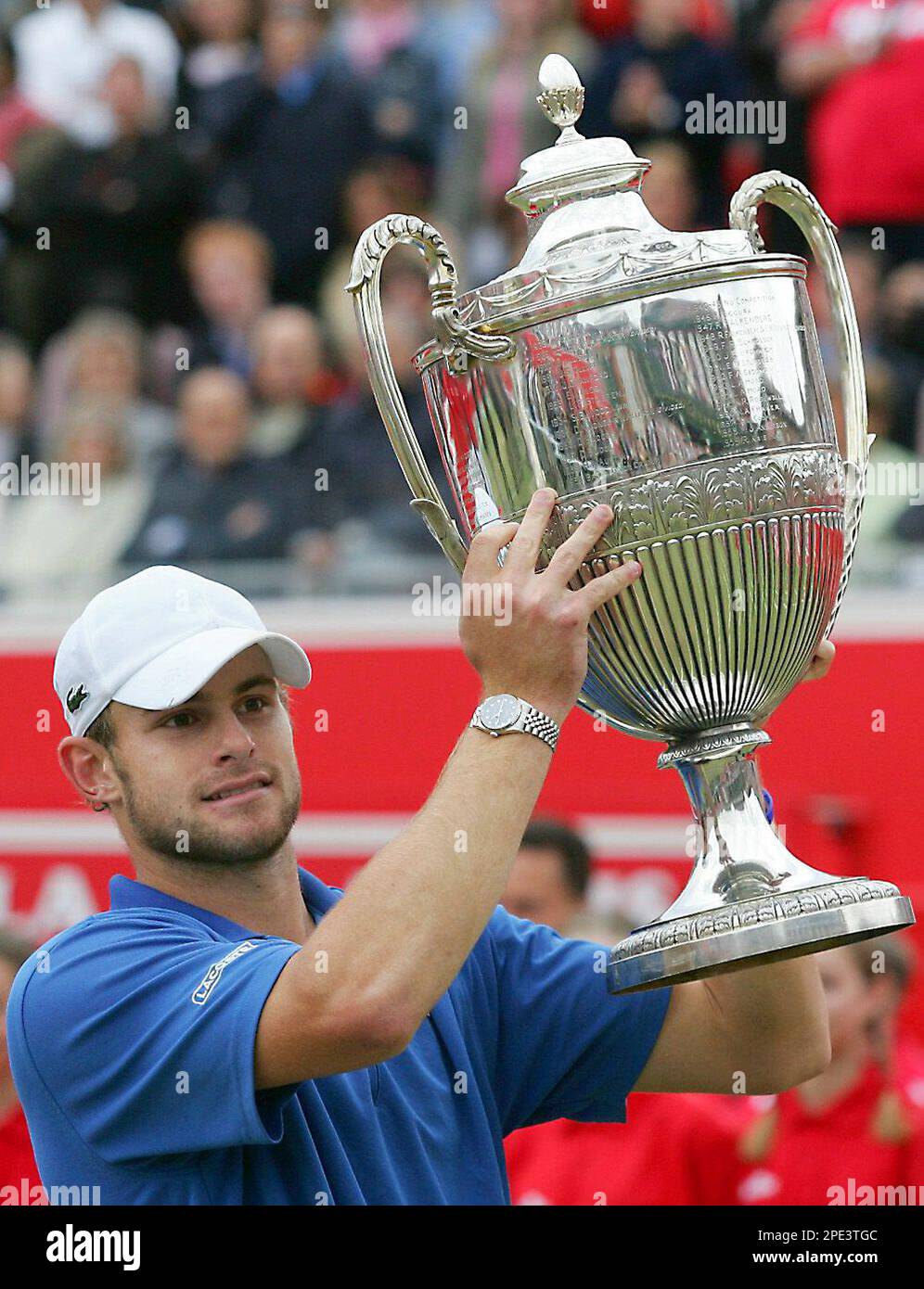 Andy Roddick of the United States holds up the trophy after his win ...