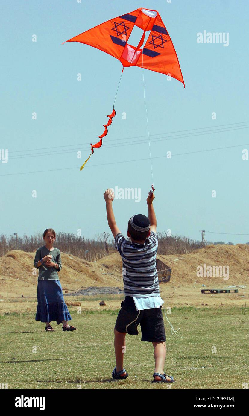 Jewish children fly an orange kite, the colour symbolizing the movement ...