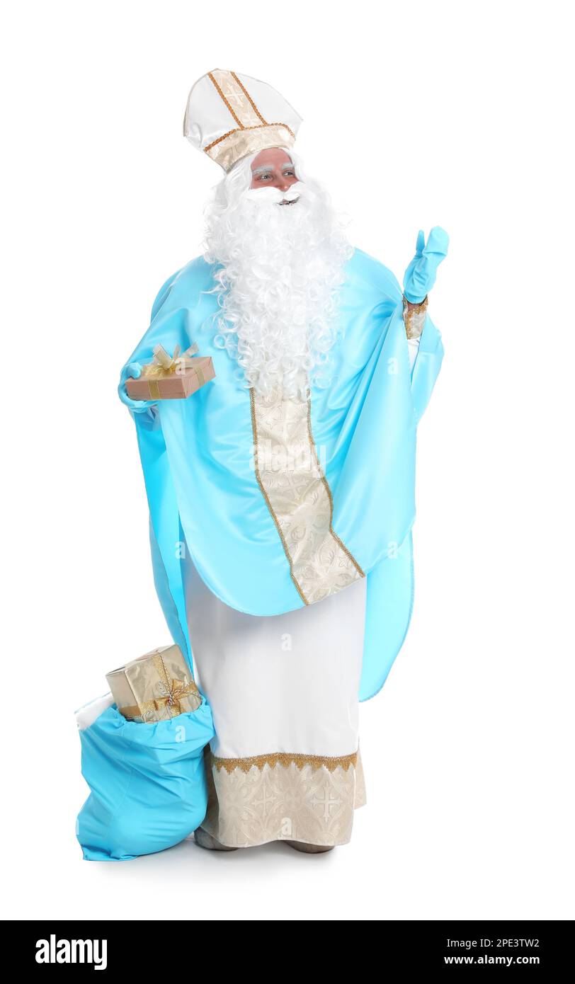 Full length portrait of Saint Nicholas near sack with presents on white ...