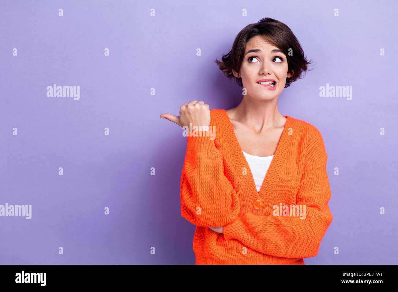 Photo of nervous unsure lady dressed orange cardigan biting lip showing ...