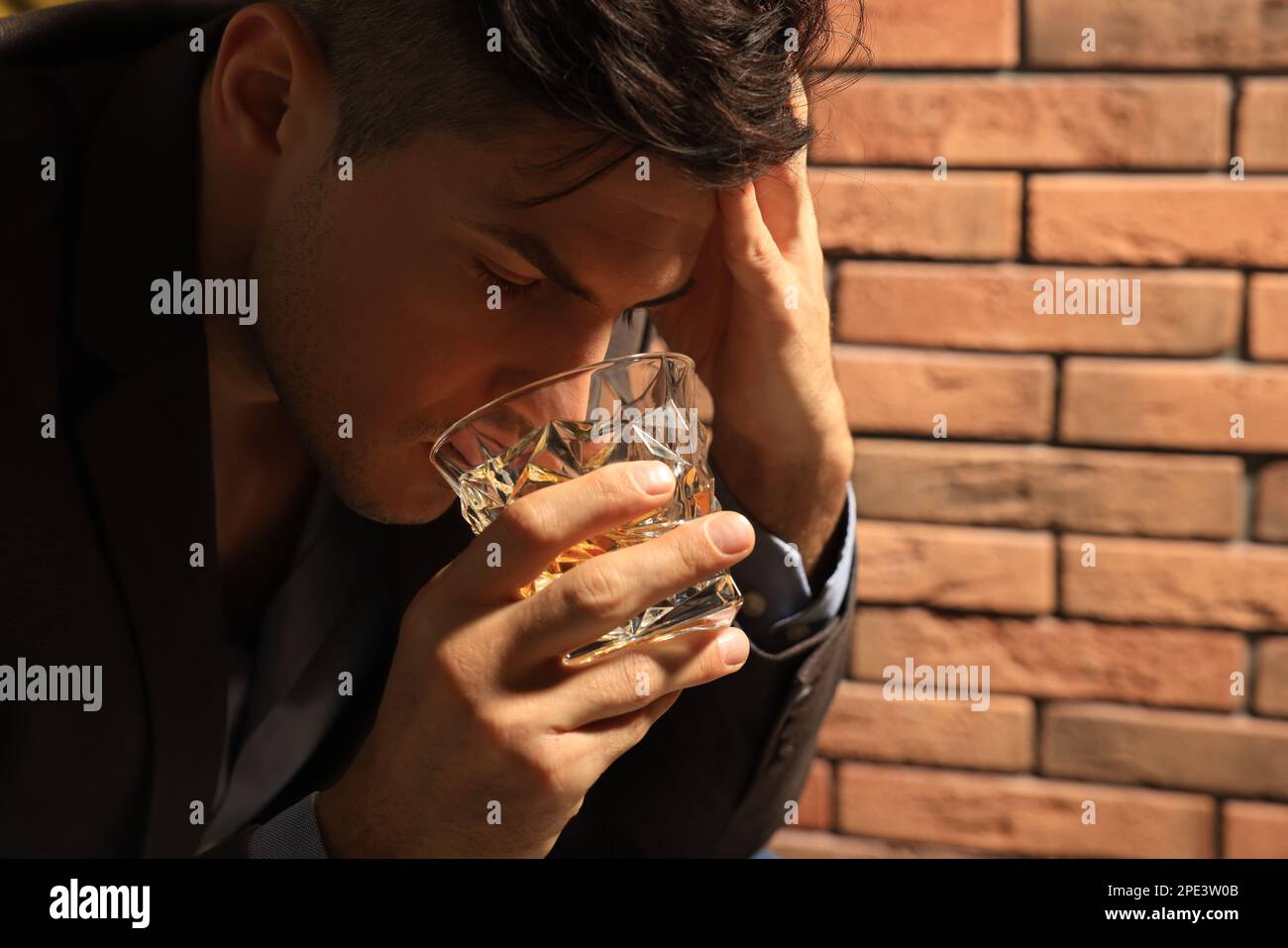 Sad drunk man drinking red hi-res stock photography and images - Alamy