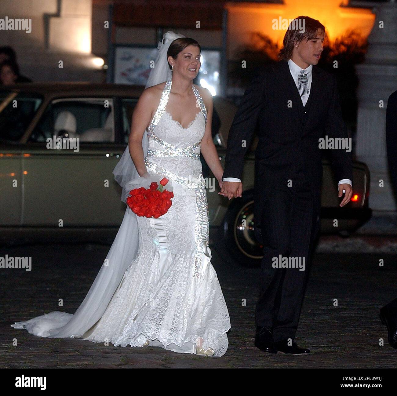 AC Milan's Argentine forward Hernan Crespo, right, walks with his bride ...