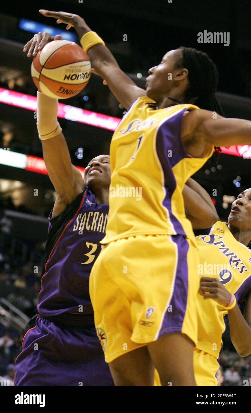 Sacramento Monarchs' Yolanda Griffith, left, gets her shot blocked by ...
