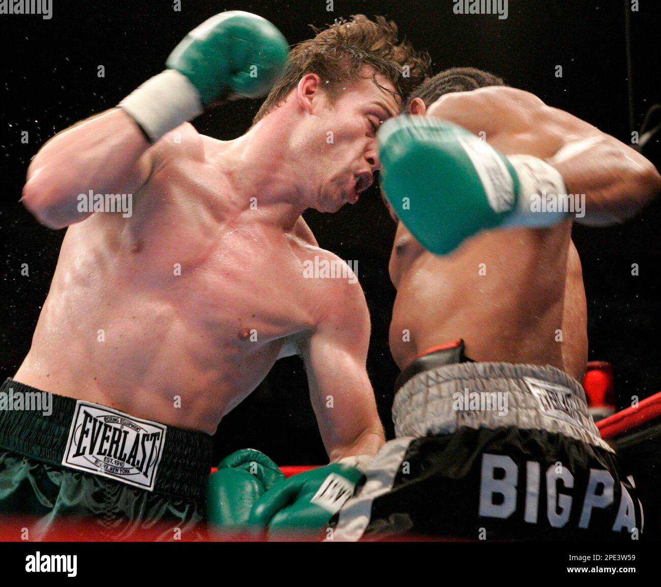 John Duddy, of Ireland, left, follows through on a punch to Patrick ...